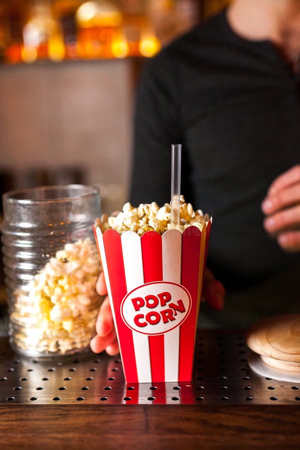 Close-up of Expert Bartender Serving Popcorn Cocktail in Bar Stock ...