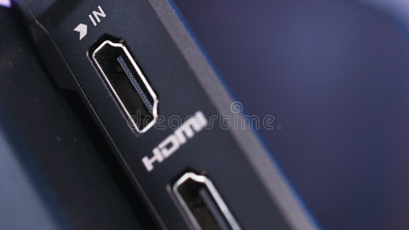 Close Up of the External Power and HDMI Connector. Action. Side View of ...