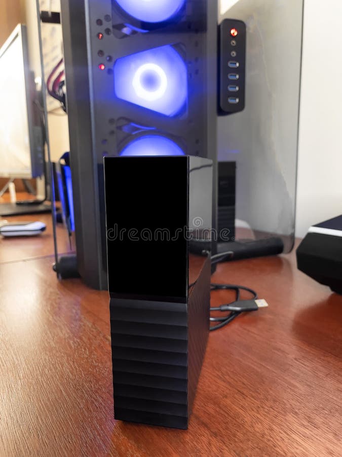 Close Up of an External USB Hard Drive with Computer in Background ...