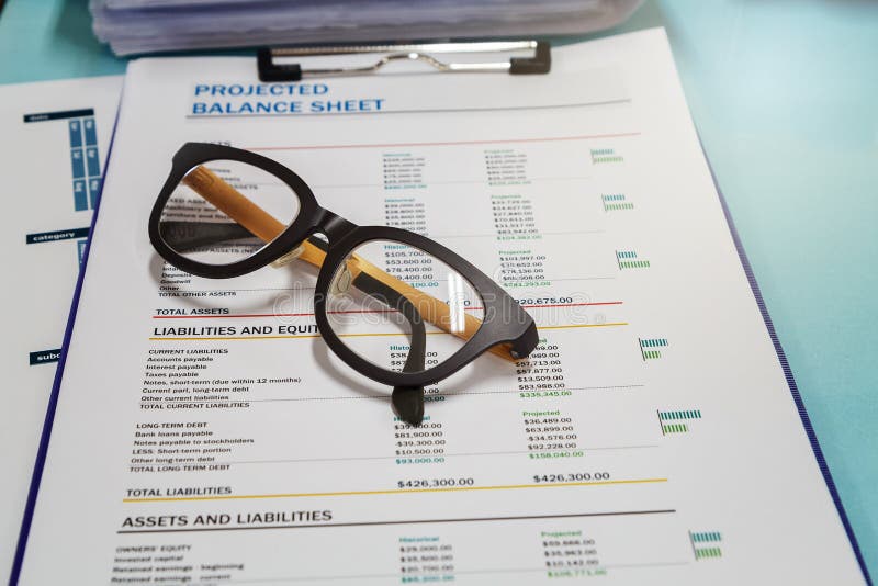 Close Up of Eye Glasses on Report Paperwork with Chart at Business ...