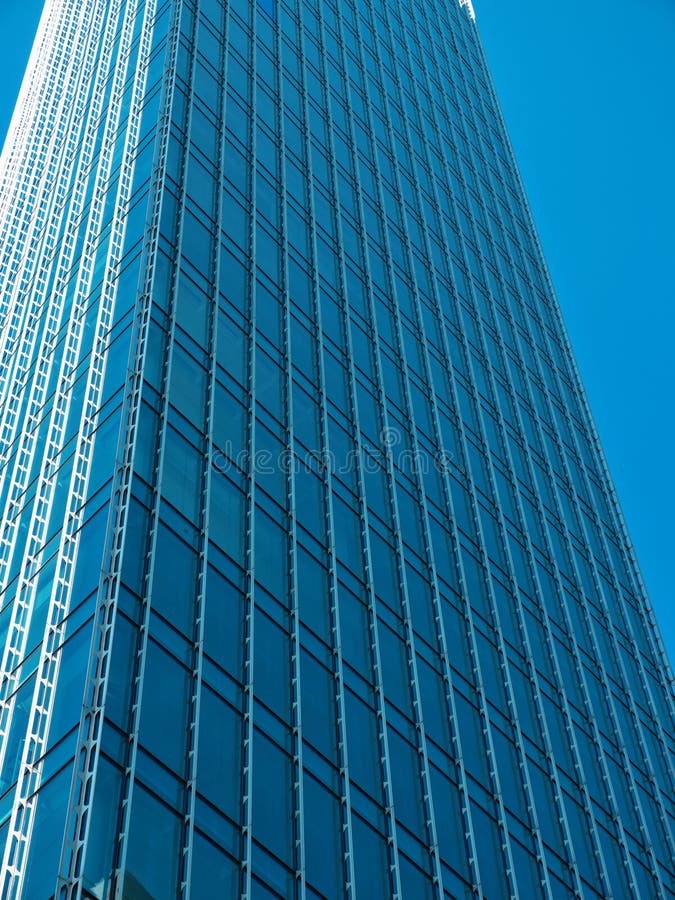 Close-up of the Facade of a High-rise Building with Large Windows and a ...