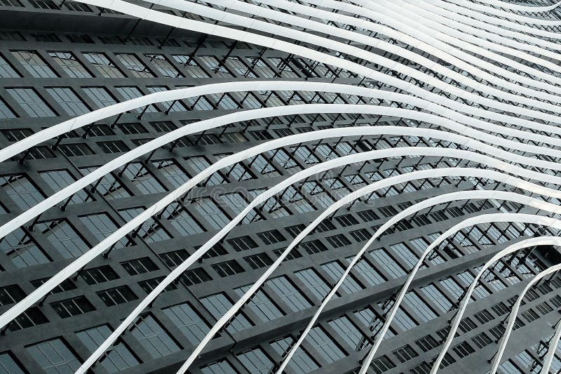 Close-up of a Facade of a Modern Building with Wavy Metallic Lines ...