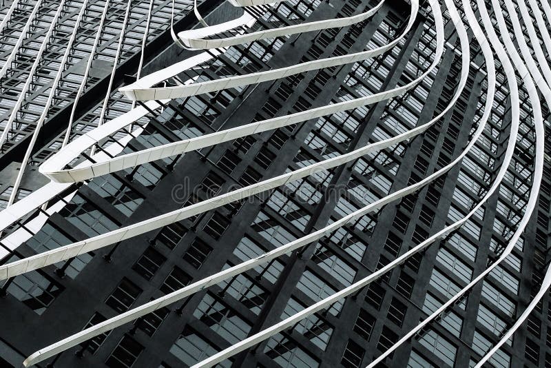 Close-up of a Facade of a Modern Building with Wavy Metallic Lines ...