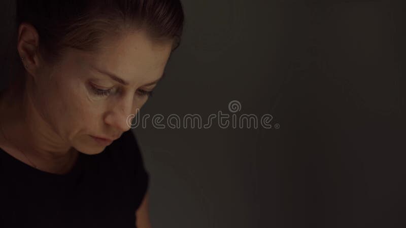 Close-up of Face of Attractive Woman Looking Down and Doing Something ...