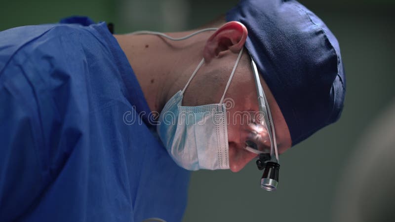 Close-up Front View Concentrated Surgeon Making Dissection on Face of ...