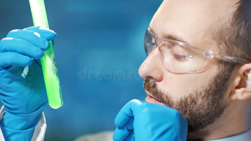 Enthusiastic Professional Male Chemist Looking on Diffusion Process of ...