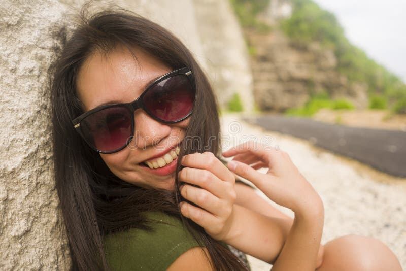 Close Up Face Portrait Outdoors Of Young Beautiful And Happy Asian