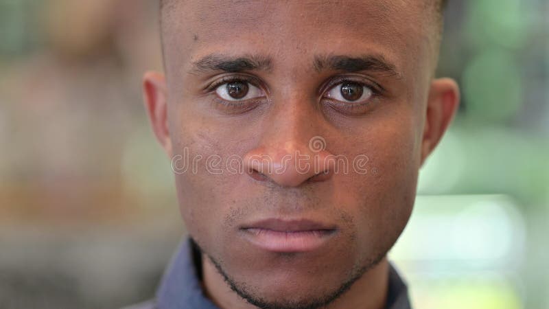 Close Up of Face of Serious Young African Man Stock Image - Image of ...