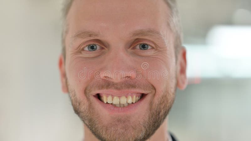 Close Up of Face of Smiling Young Man Stock Photo - Image of busy ...