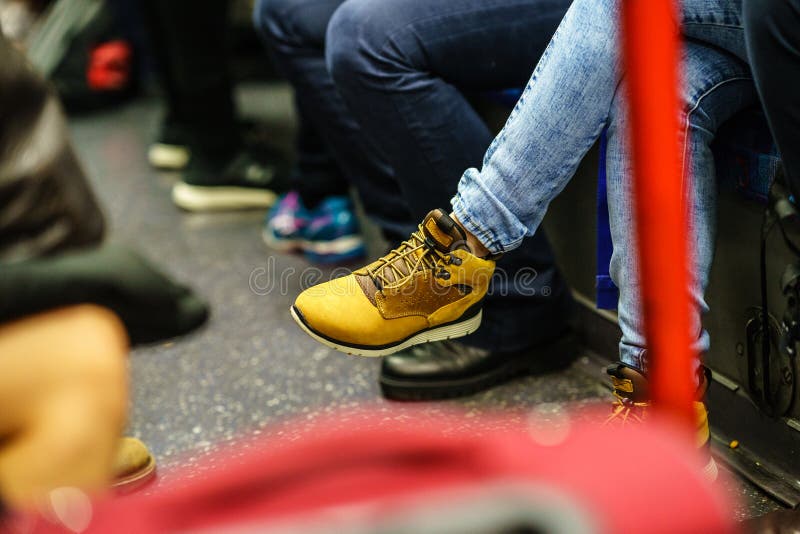 Close-up of the Feet of Diverse Passengers on the Local Buses Stock ...