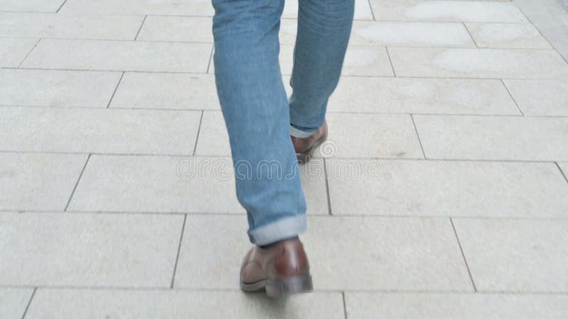 Close Up of Feet of Man Walking on Pavement, Side View Stock Video ...