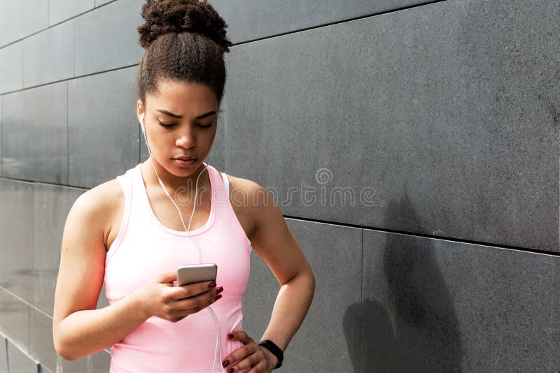 Close-up of Female Athlete Using Mobile Phone Stock Image - Image of ...
