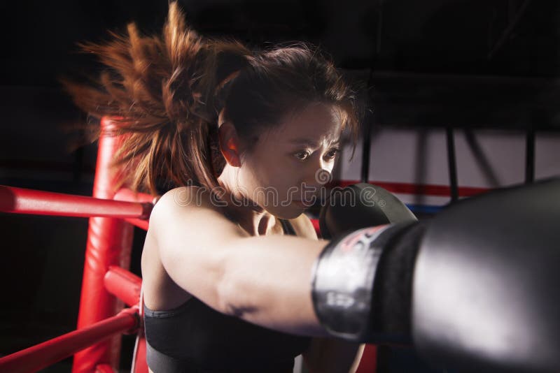 Close Up of Female Boxer Throwing a Punch, Hair in Motion Stock Image ...