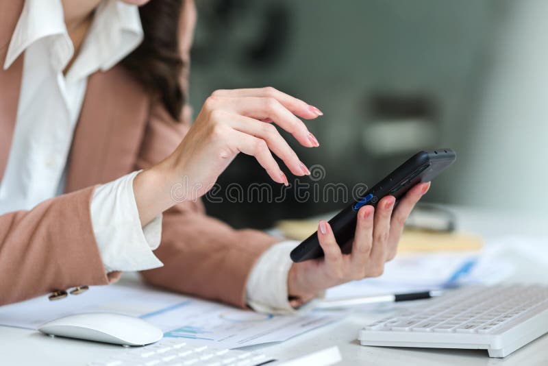Close-up of Female Business Person Hands Using Smart Phone while ...