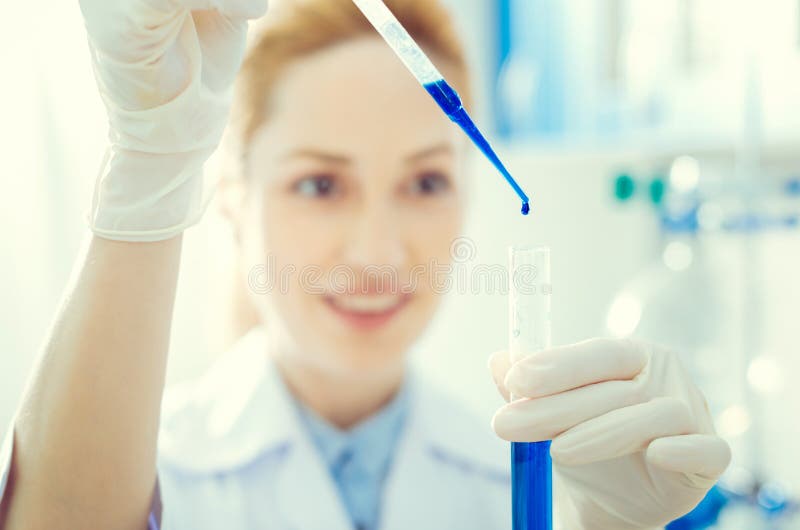 Close Up of Female Chemist Adding Liquid during Experiment Stock Photo ...