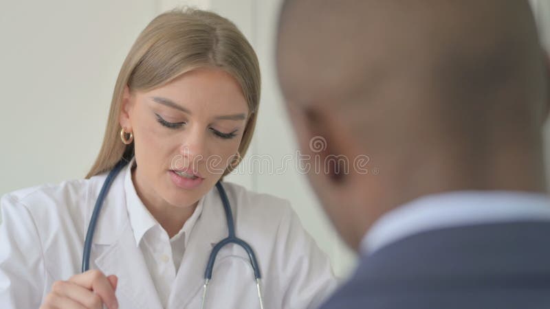Close Up of Female Doctor Talking with African Doctor Stock Footage ... Close Up of Female Doctor Talking with African Doctor Stock Footage ...