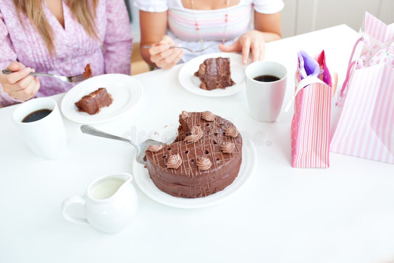 Close-up of Female Friends Eating a Chocolate Cake Stock Photo - Image ...