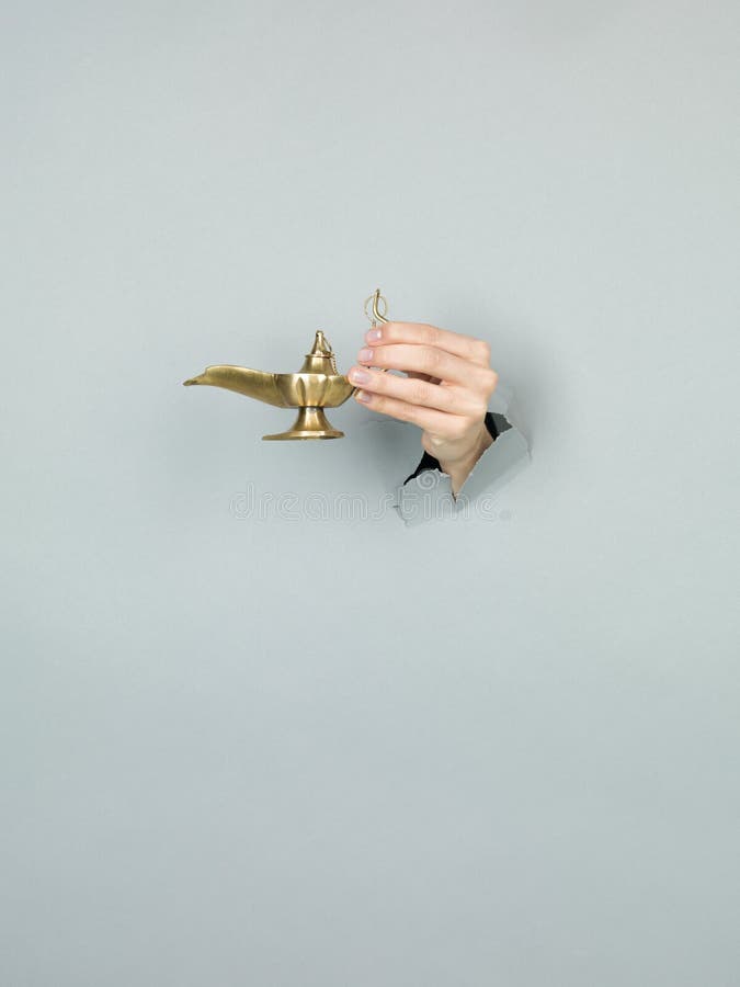 Female Hand Holding Magic Lamp Stock Photo - Image of lamp, kids: 29809282