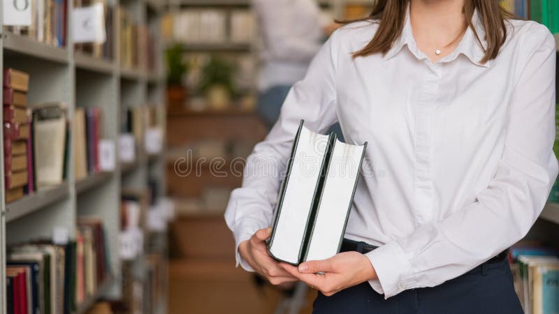 Close-up of Female Hands with Books in Public Library. Stock Image ...