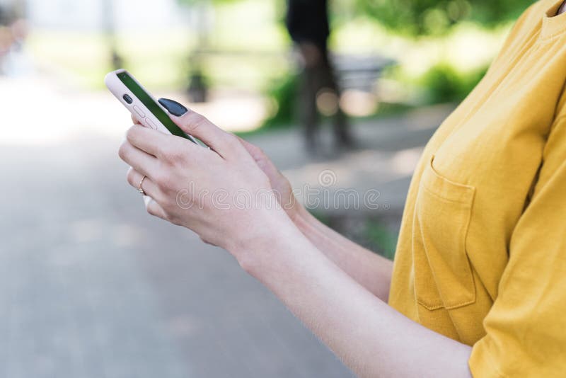 Close Up Female Hands Holding a Smartphone. Typing a Message. Stock ...