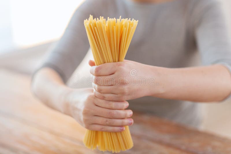 Close Up of Female Hands Holding Spaghetti Pasta Stock Image - Image of ...