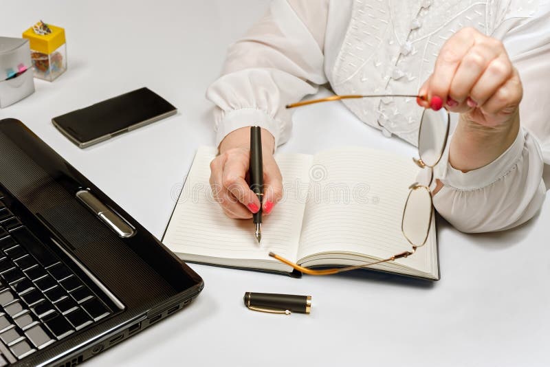 Close-up of Female Hands with Laptop, Smartphone and Notebook Stock ...