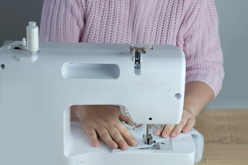 Close-up of Female Hands Perform Work on White Sewing Electric Computer ...