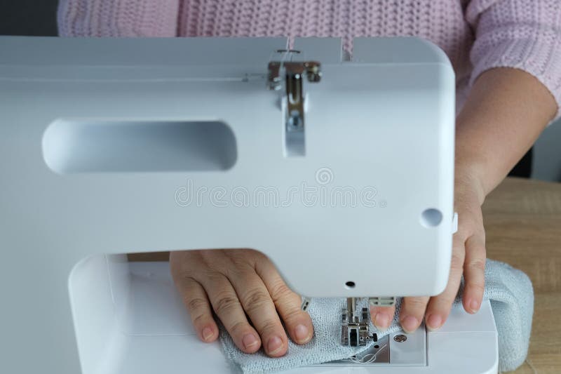 Close-up of Female Hands Perform Work on a White Sewing Electric ...