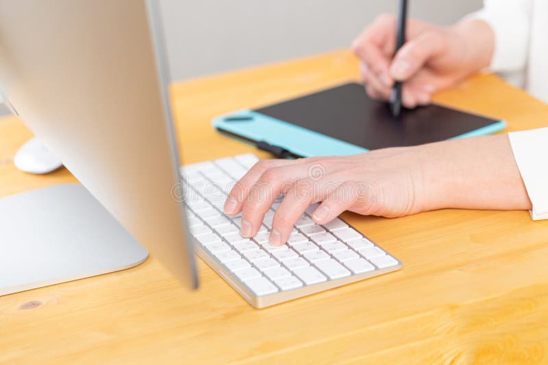 Close-up of Female Hands Using Digital Graphics Tablet and Stylus while ...