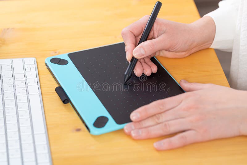 Close-up of Female Hands Using Digital Graphics Tablet and Stylus while ...
