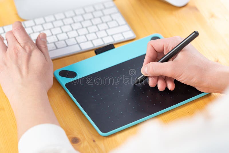 Close-up of Female Hands Using Digital Graphics Tablet and Stylus while ...
