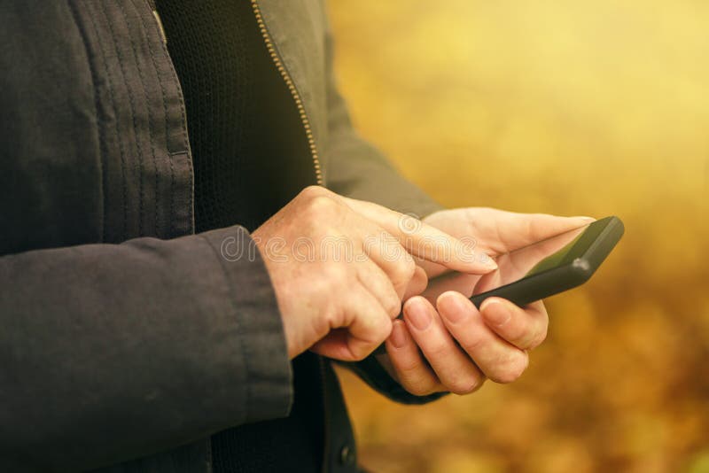 Close Up of Female Hands Using Mobile Phone Outdoors Stock Photo ...