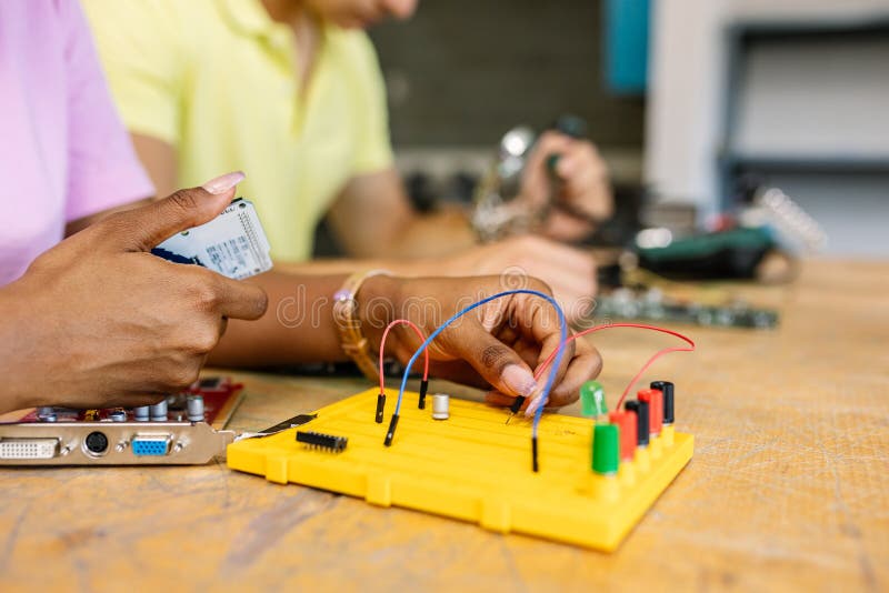 Close Up Female Student Hands Creating Electronic Circuits and Robotics ...