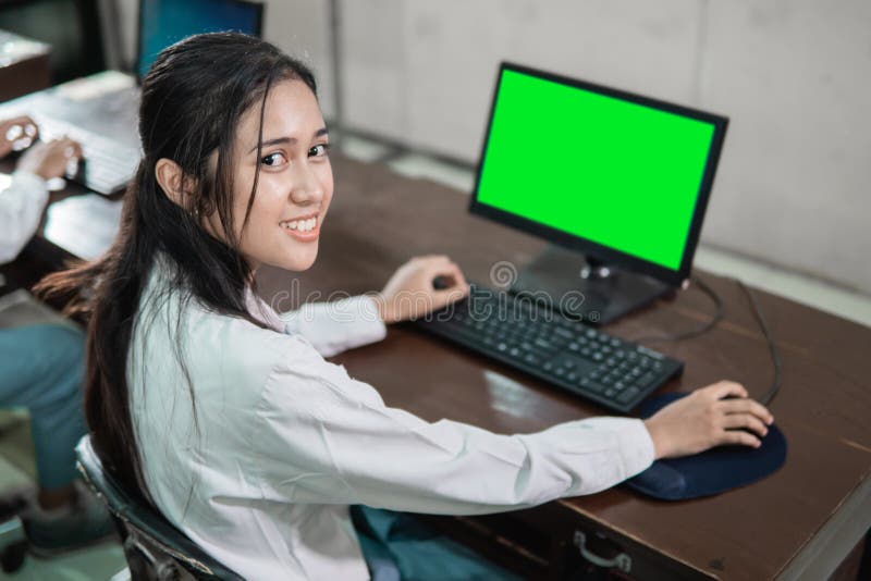 Close Up of a Female Student Smiling with a Look Back while Using a ...
