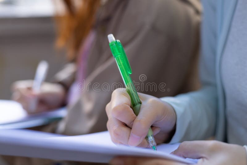 Close Up of Female Student or Worker Taking Note Using a Pen and ...
