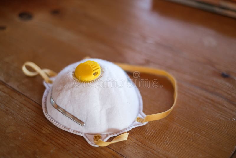 Face Protection Mask Lying on Wooden Table Stock Image - Image of ...