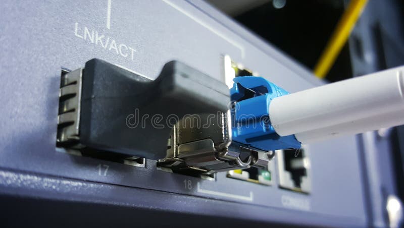 Close Up Fiber Optic Cable Connect To Network Device. Stock Photo ...