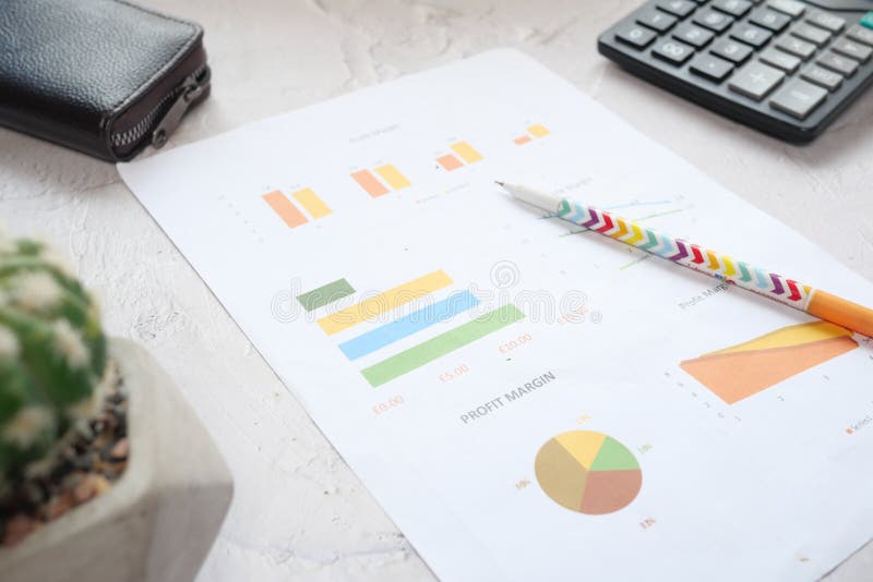 Close Up of Financial Charts and Pen on Table Stock Image - Image of ...