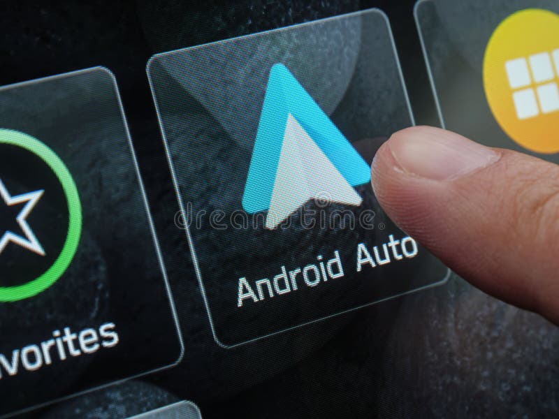 Close Up of a Finger Activating the Android Auto Application on a ...