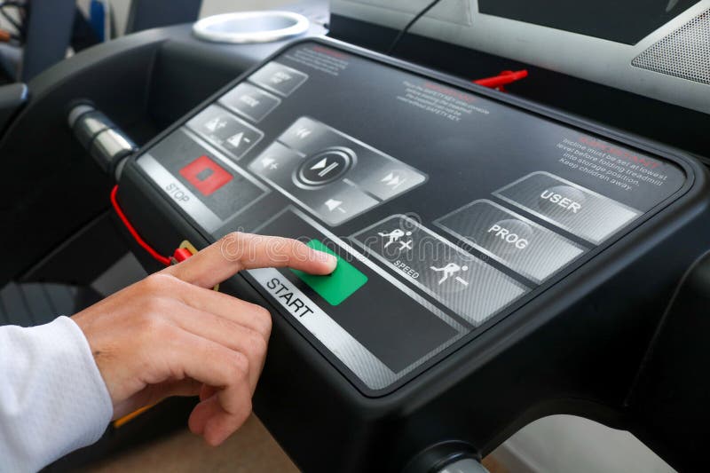 Close Up of Finger Pushing Quick Start Button on Treadmill. Buttons on ...