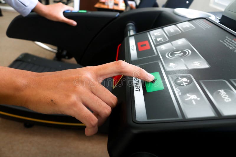 Close Up of Finger Pushing Quick Start Button on Treadmill. Buttons on ...