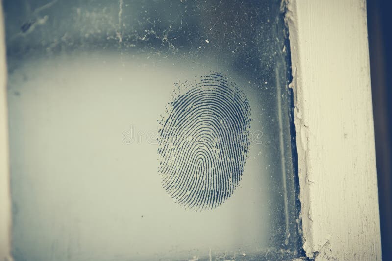 Close-up of Fingerprint on Glass Surface Symbolizing Privacy and ...
