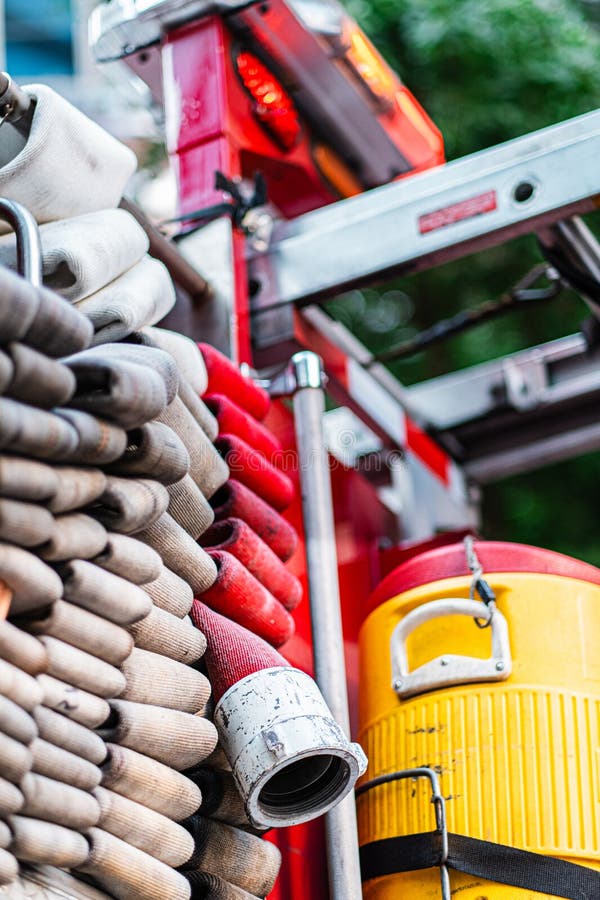 Close-Up of Fire Engine Equipment Featuring Coiled Fire Hoses and a ...