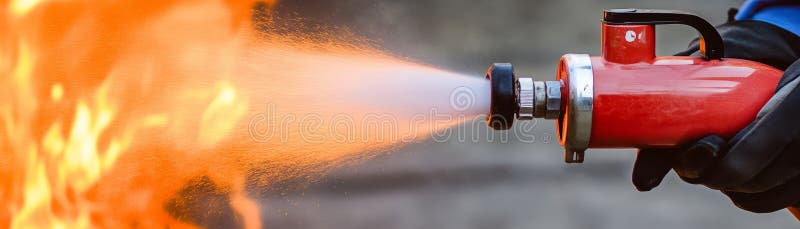 A Close-up of a Fire Extinguisher in Action, Combating Flames with ...