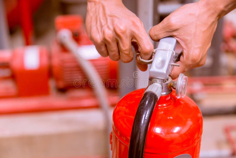 Close Up Fire Extinguisher and Pulling Pin on Red Tank Stock Photo ...