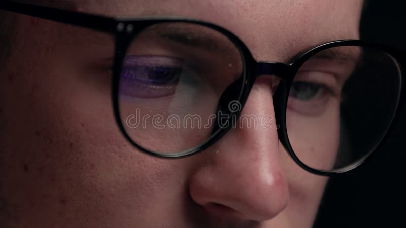 Close Up Focused Face Of Programmer In Computer Glasses With Monitors Reflection Works Online