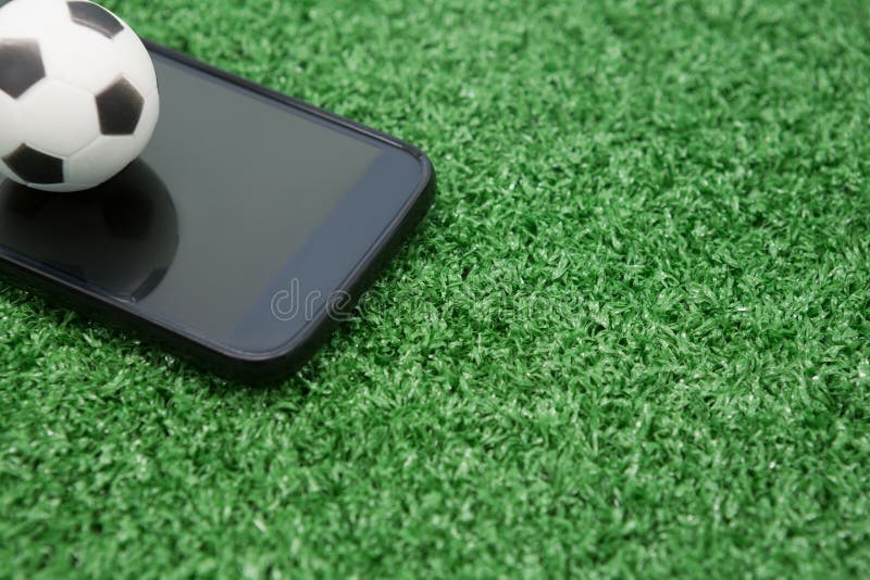Football and Mobile Phone on Artificial Grass Stock Photo - Image of ...