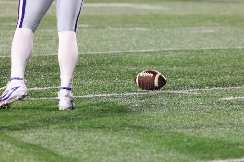Close-up of a Football Player Standing on the Field by a Football Stock ...