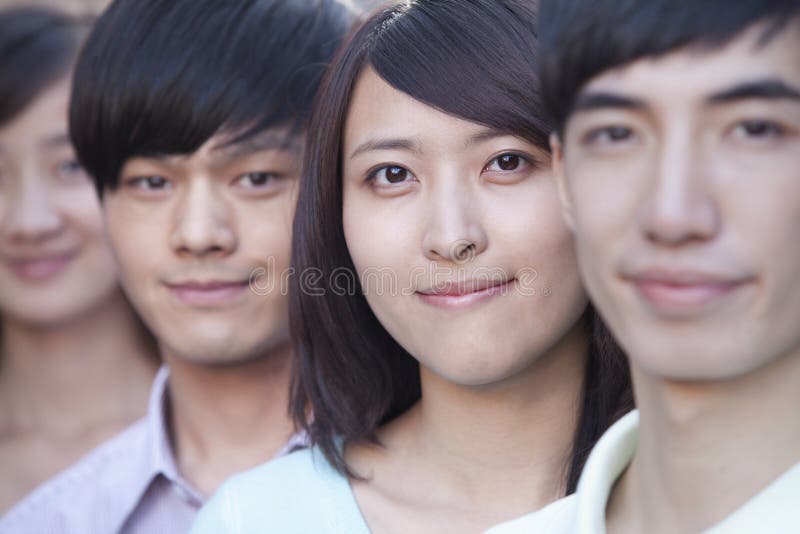 Close Up of Four Young People Standing in a Row in Beijing Stock Photo ...