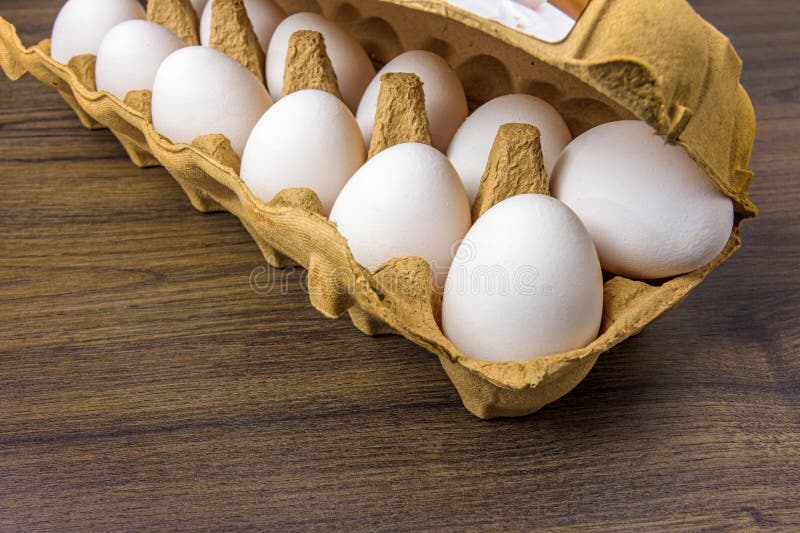 Eggs in egg carton stock image. Image of table, farm - 302800437